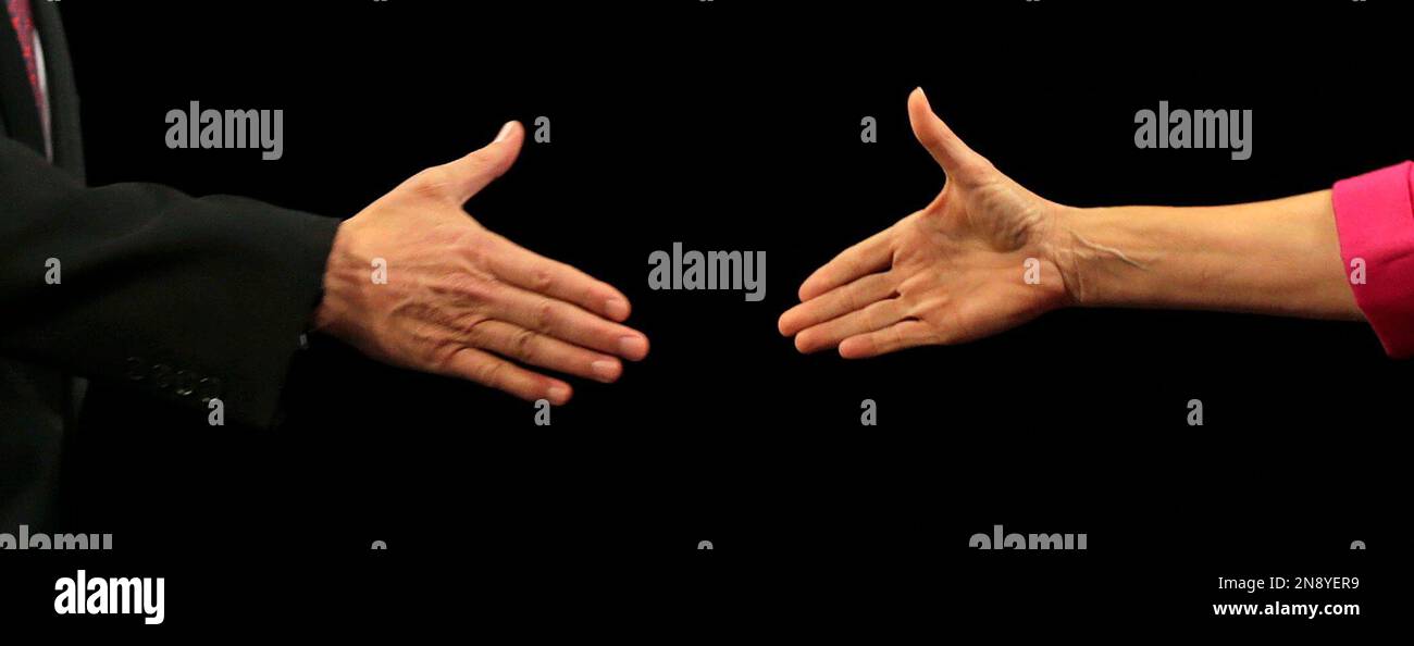 Republican U.S. Sen. Scott Brown, left, shakes hands with his ...