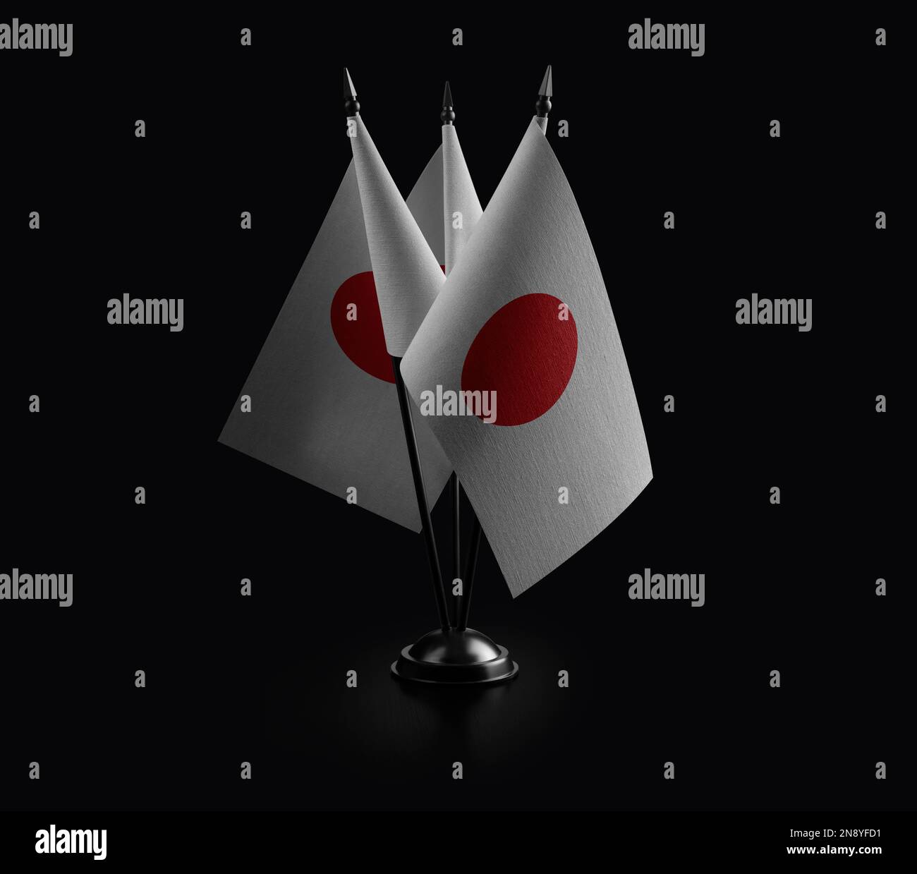 Small national flags of the Japan on a black background Stock Photo - Alamy