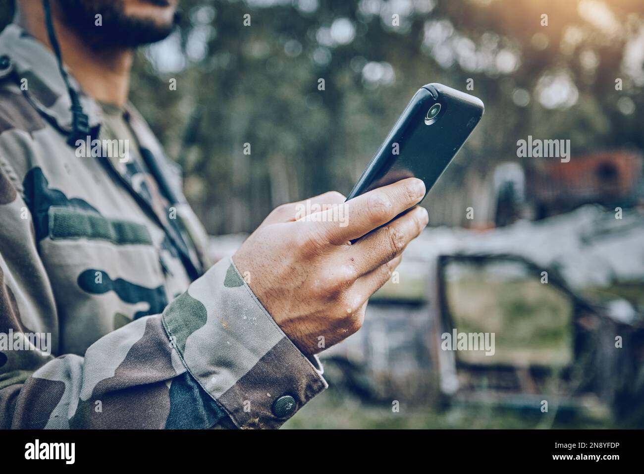 Military soldier, mobile phone and communication while outdoor for ...