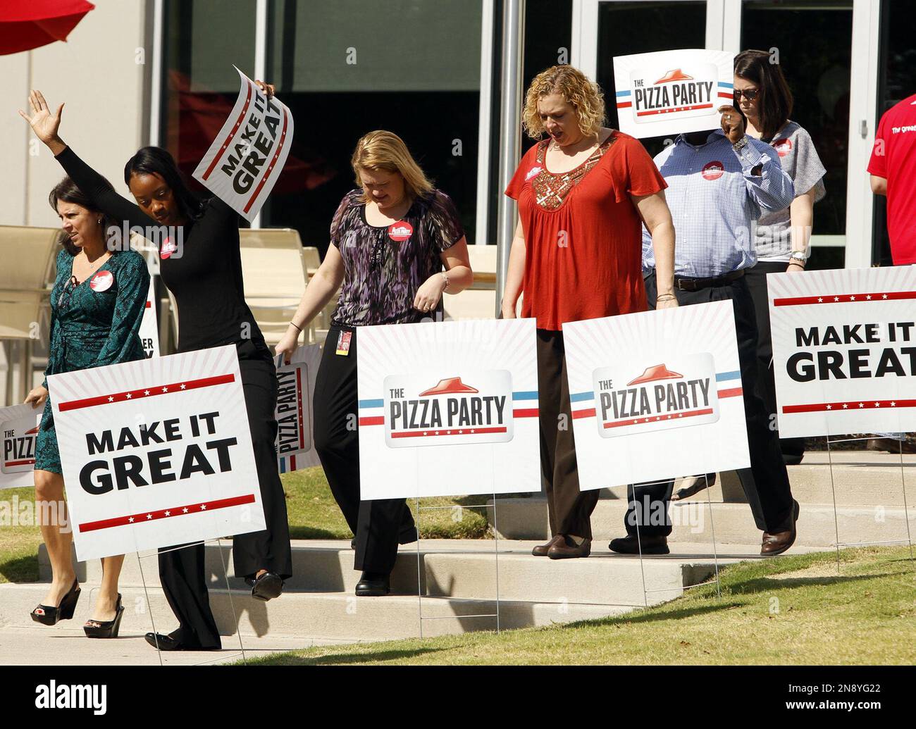 Advocates of The Pizza Party make their way to a rally to show their ...
