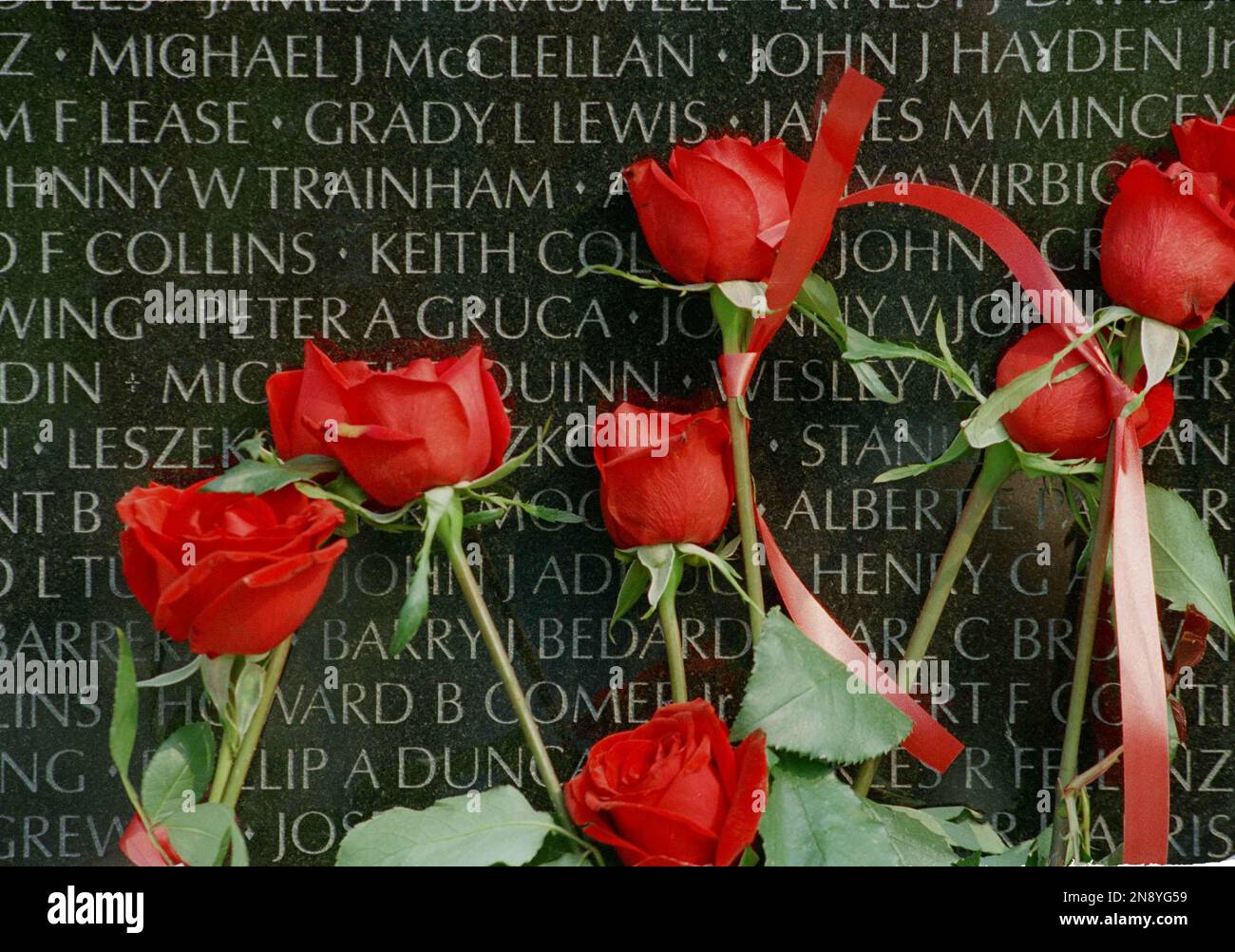 Roses line the bottom of the Vietnam Veterans Memorial in Washington, D ...