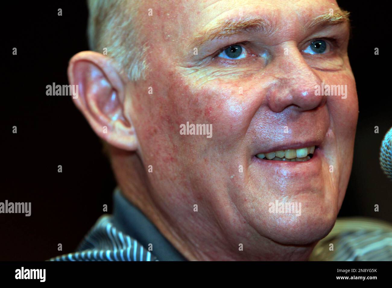 Denver Nuggets head coach George Karl jokes with reporters during a ...