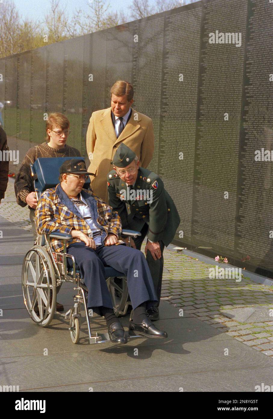 Vietnam veteran Larry Swank of Troy, Ohio, seated in wheelchair, pays a ...