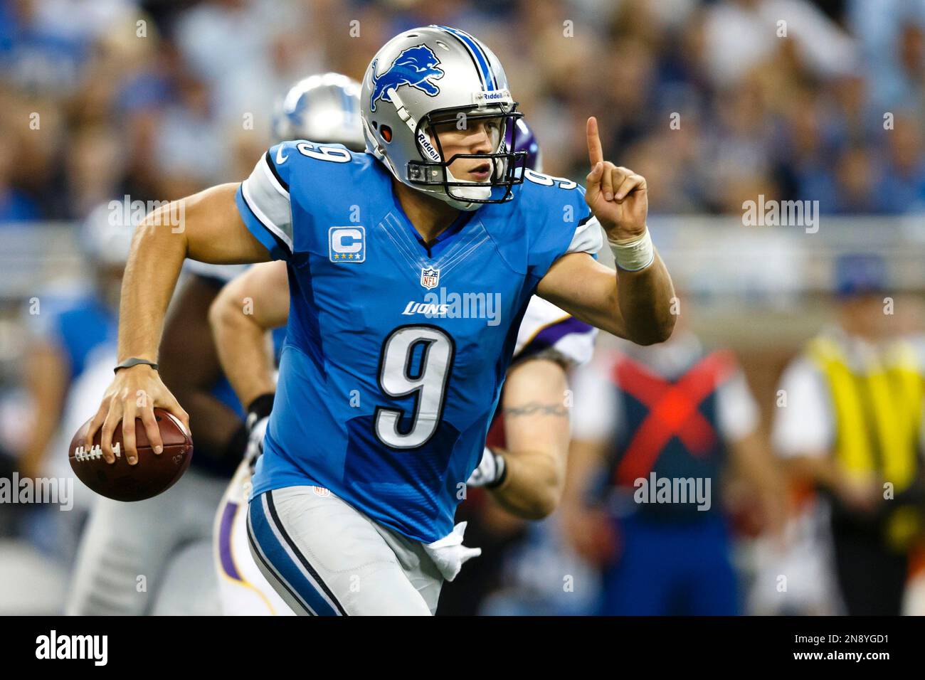 Detroit Lions quarterback Matthew Stafford (9) rolls out to pass during ...