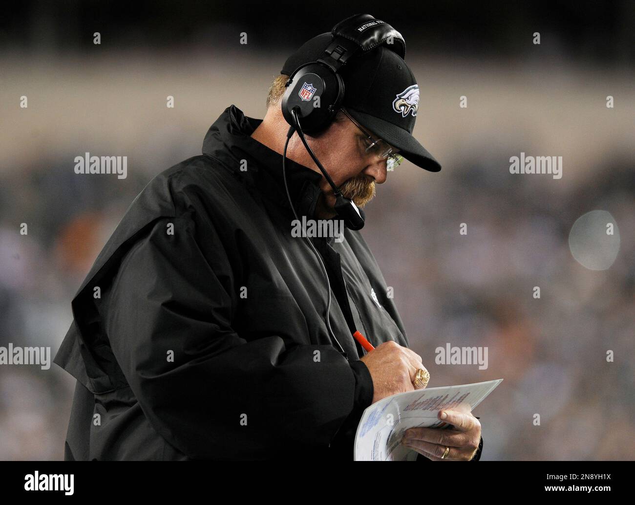 Philadelphia Eagles coach Andy Reid looks at his play card during the ...