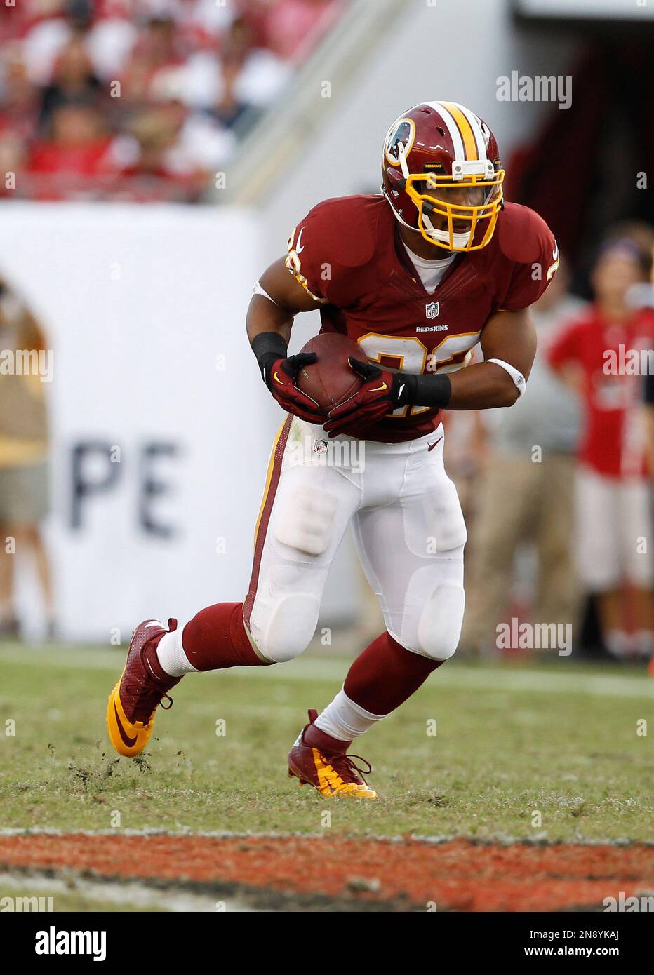 Washington Redskins running back Evan Royster (22) finds a hole in the ...