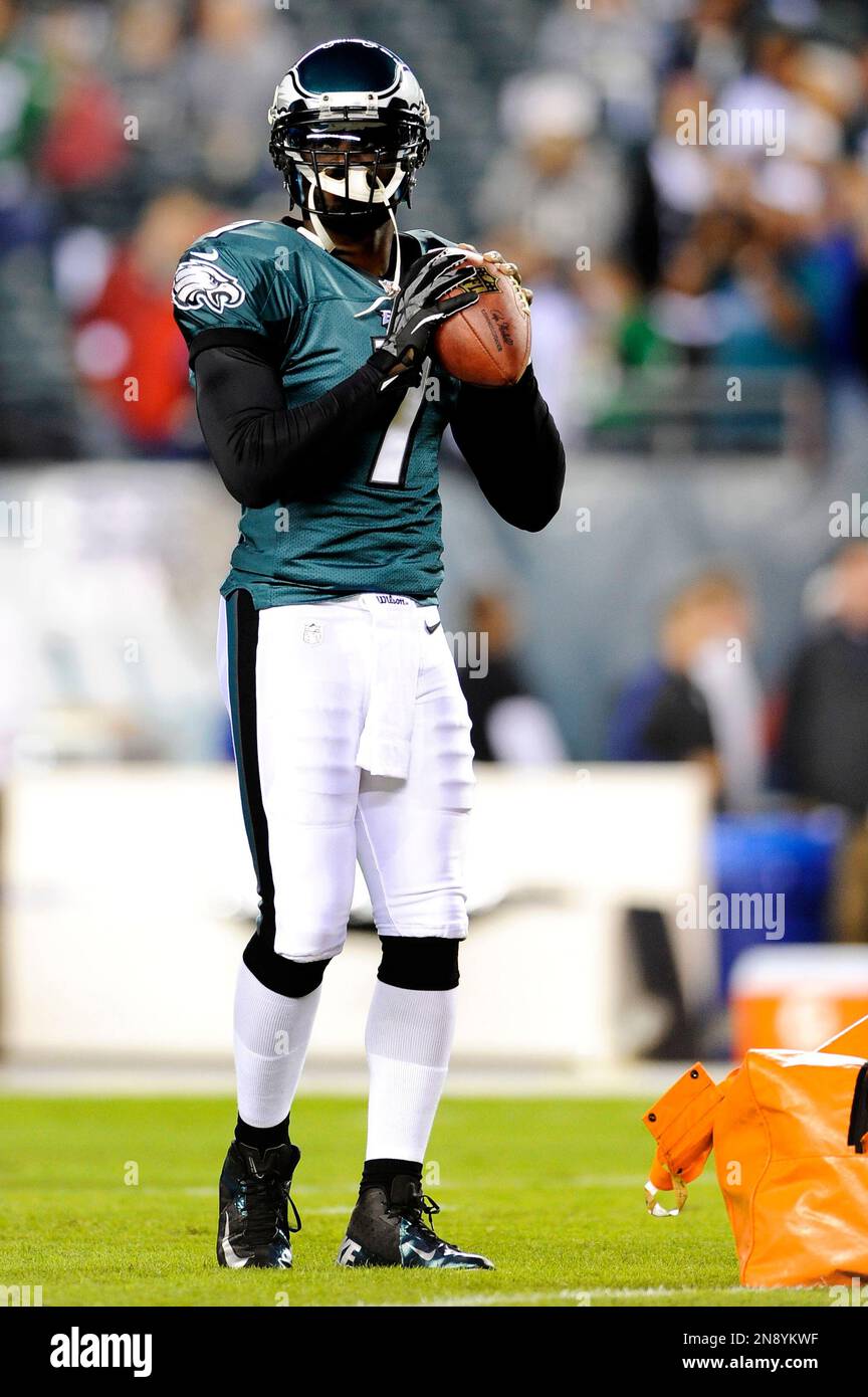 Philadelphia Eagles quarterback Michael Vick holds a football before an ...
