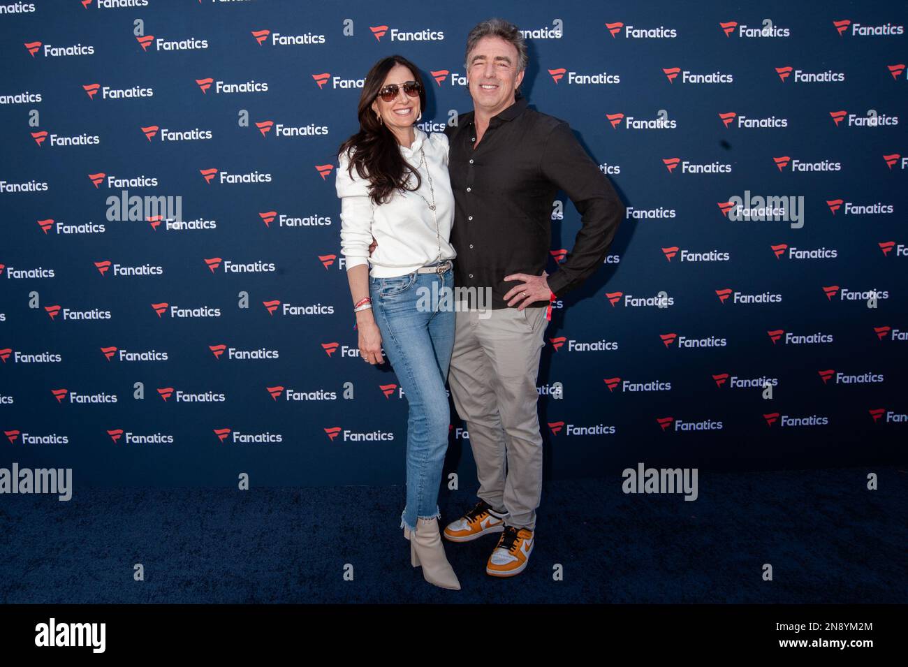 Emilia Fazzalari and Wyc Grousbeck walking on the red carpet at Michael ...