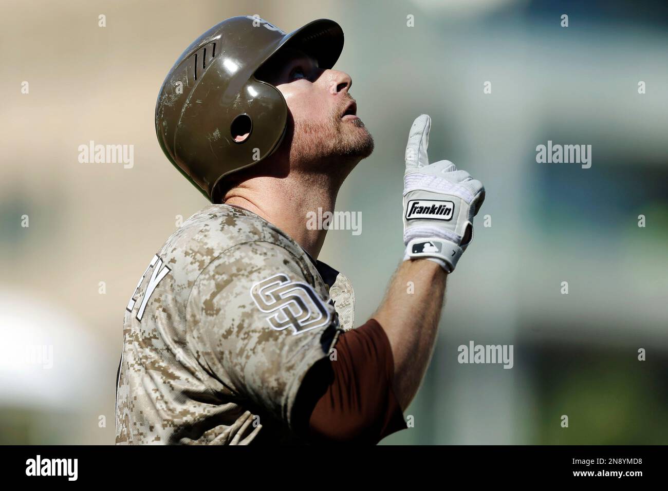 San Diego Padres' Chase Headley points skyward after hitting a home run ...