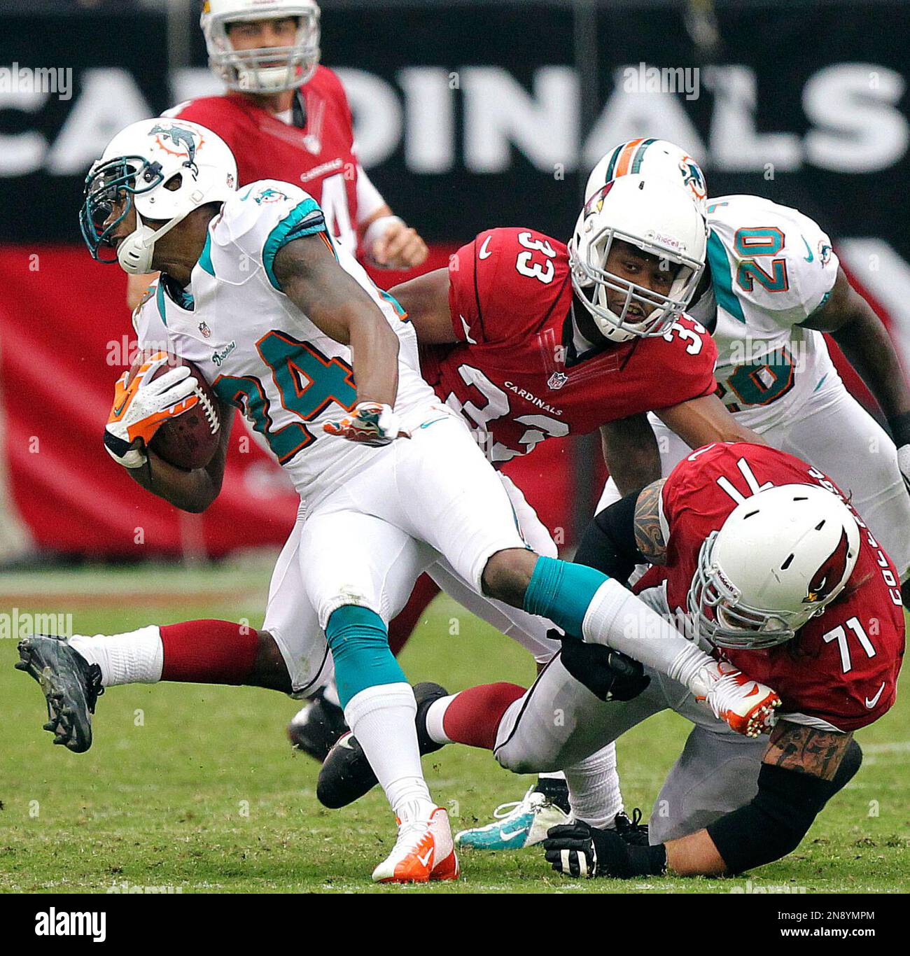 Miami Dolphins cornerback Sean Smith (24) is tackled by Arizona ...