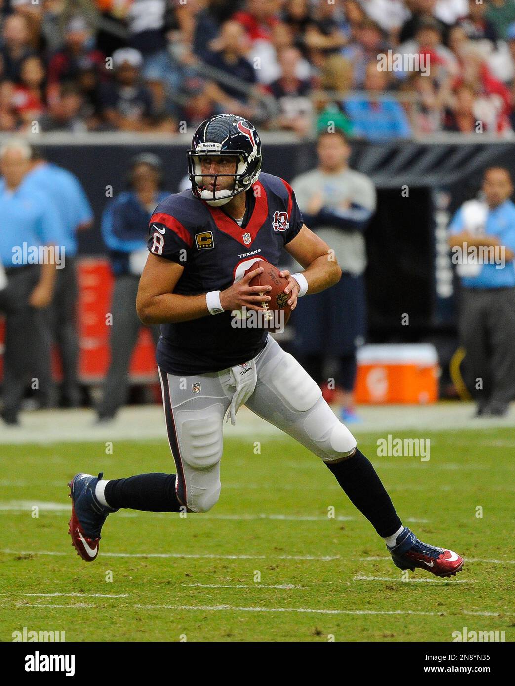 Houston Texans quarterback Matt Schaub rolls out in the first quarter ...