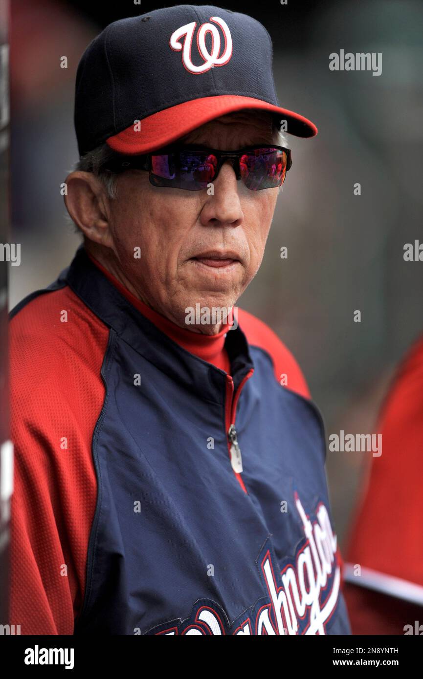 Washington Nationals manager Davey Johnson works in the dugout during a ...