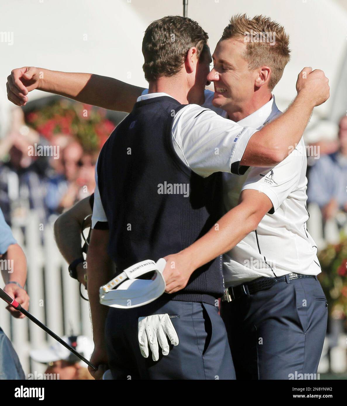 Europe's Ian Poulter, right, congratulates Justin Rose after Rose ...