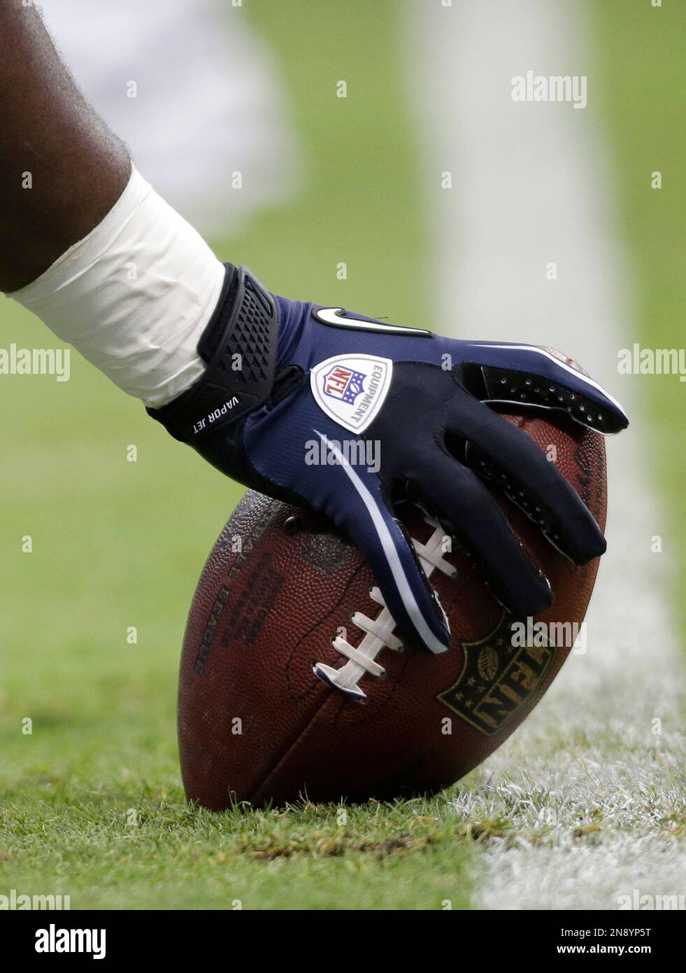 An NFL football prepared to be snapped before an NFL football game ...