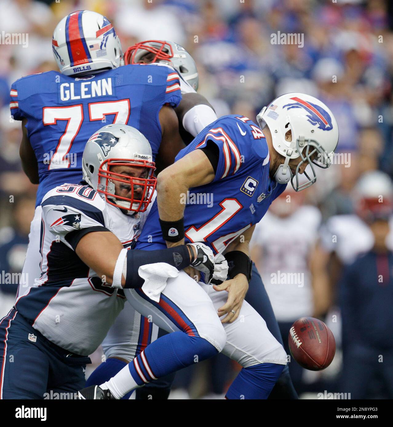 Buffalo Bills' Ryan Fitzpatrick (14) is sacked by New England Patriots ...