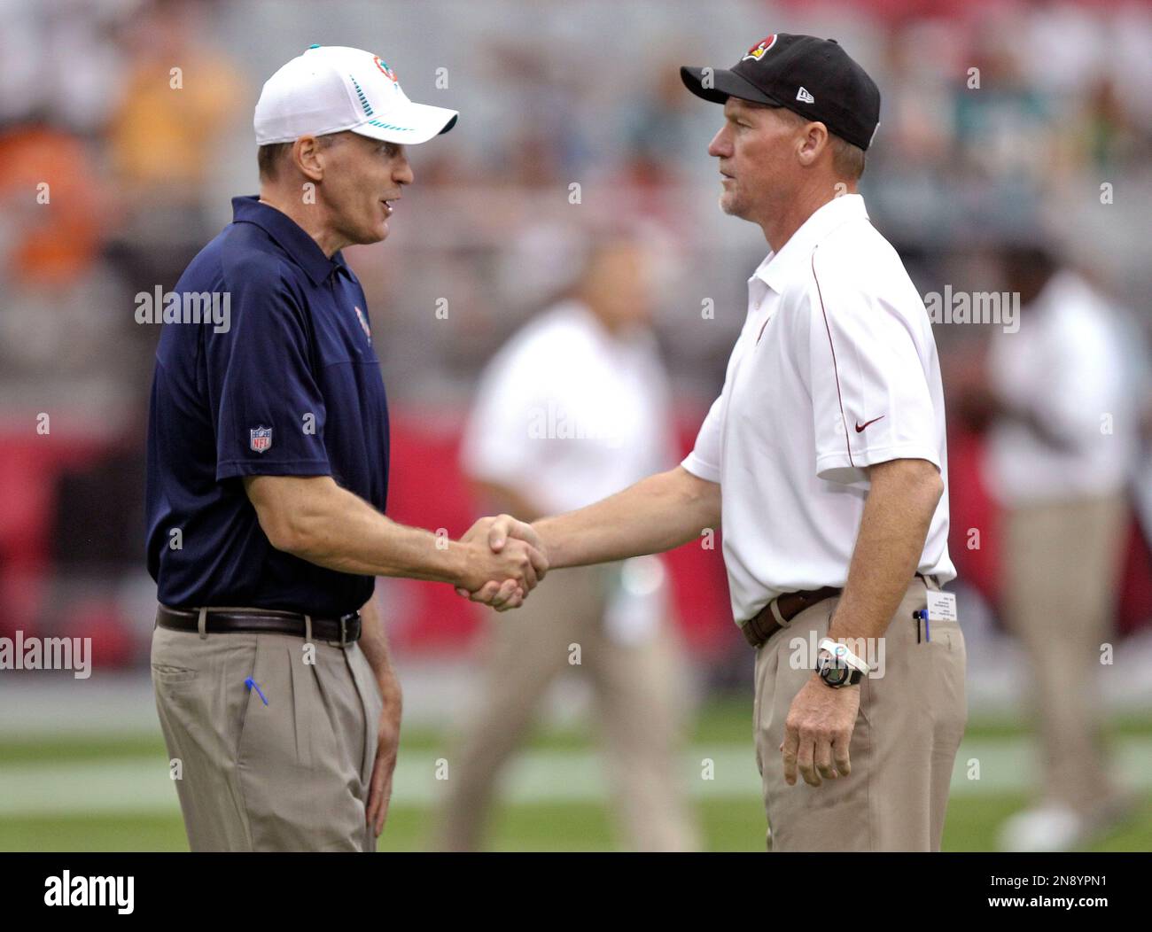 Miami Dolphins head coach Joe Philbin, left, greets Arizona Cardinals ...
