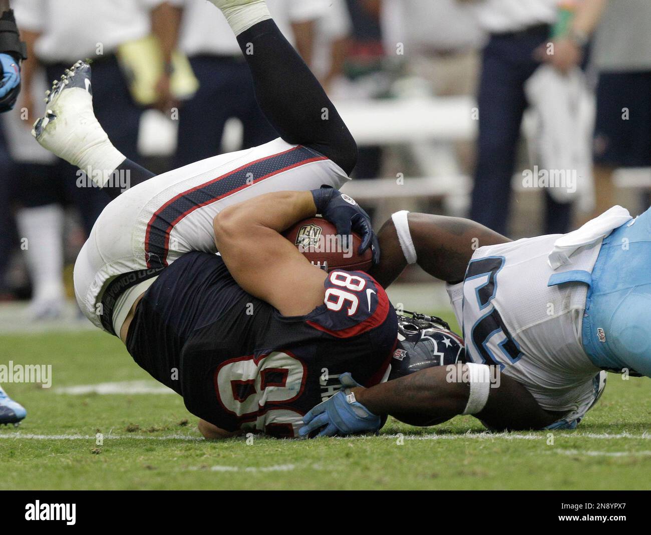 Houston Texans fullback James Casey (86 is stopped by Tennessee Titans ...