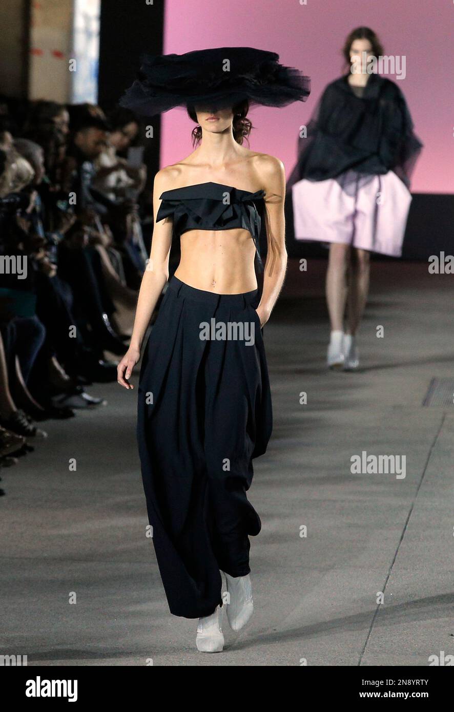 A model wears a creation by fashion designer Bill Gaytten for John ...