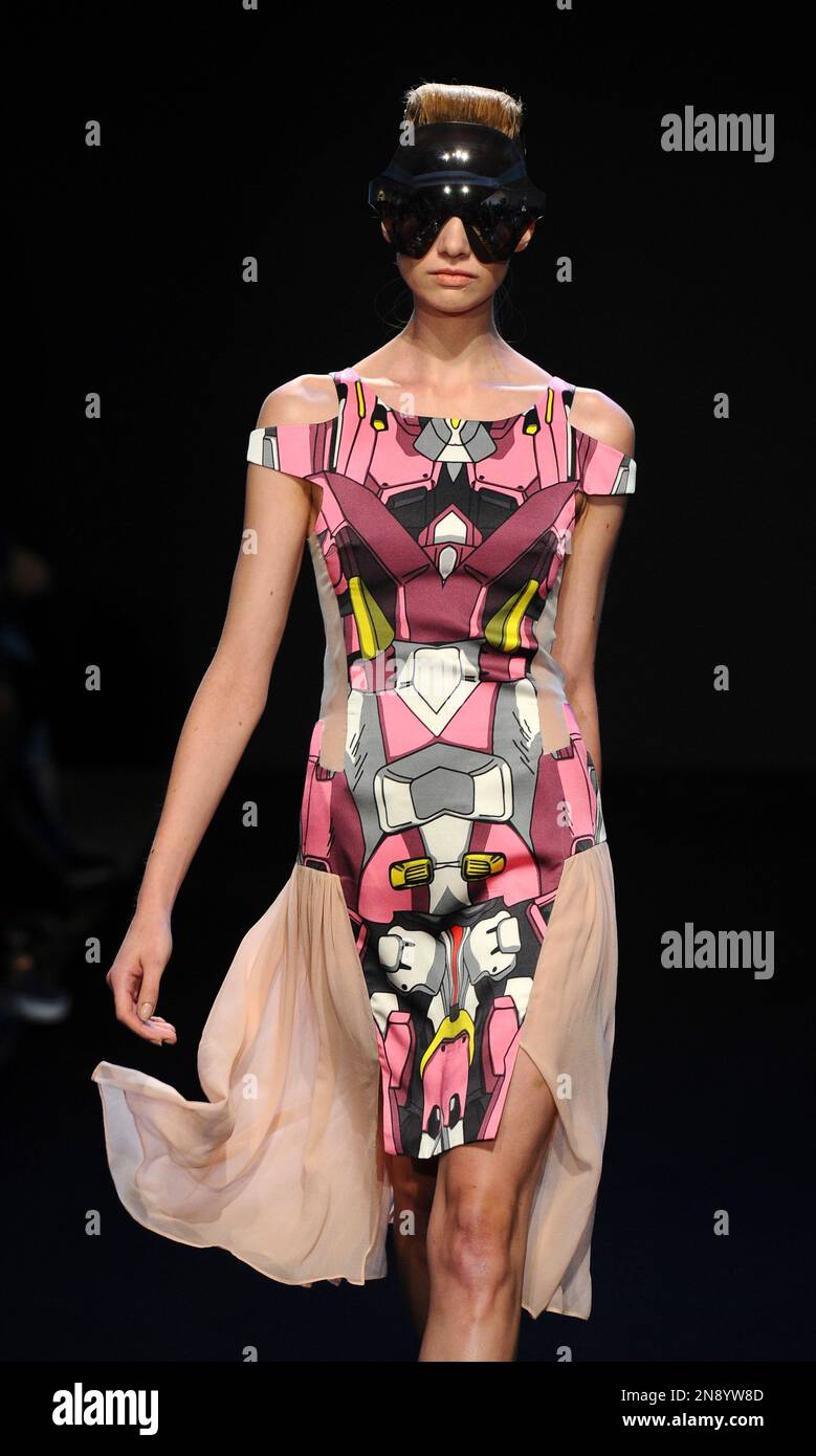 A model shows a creation by British fashion designers and brothers Eri ...