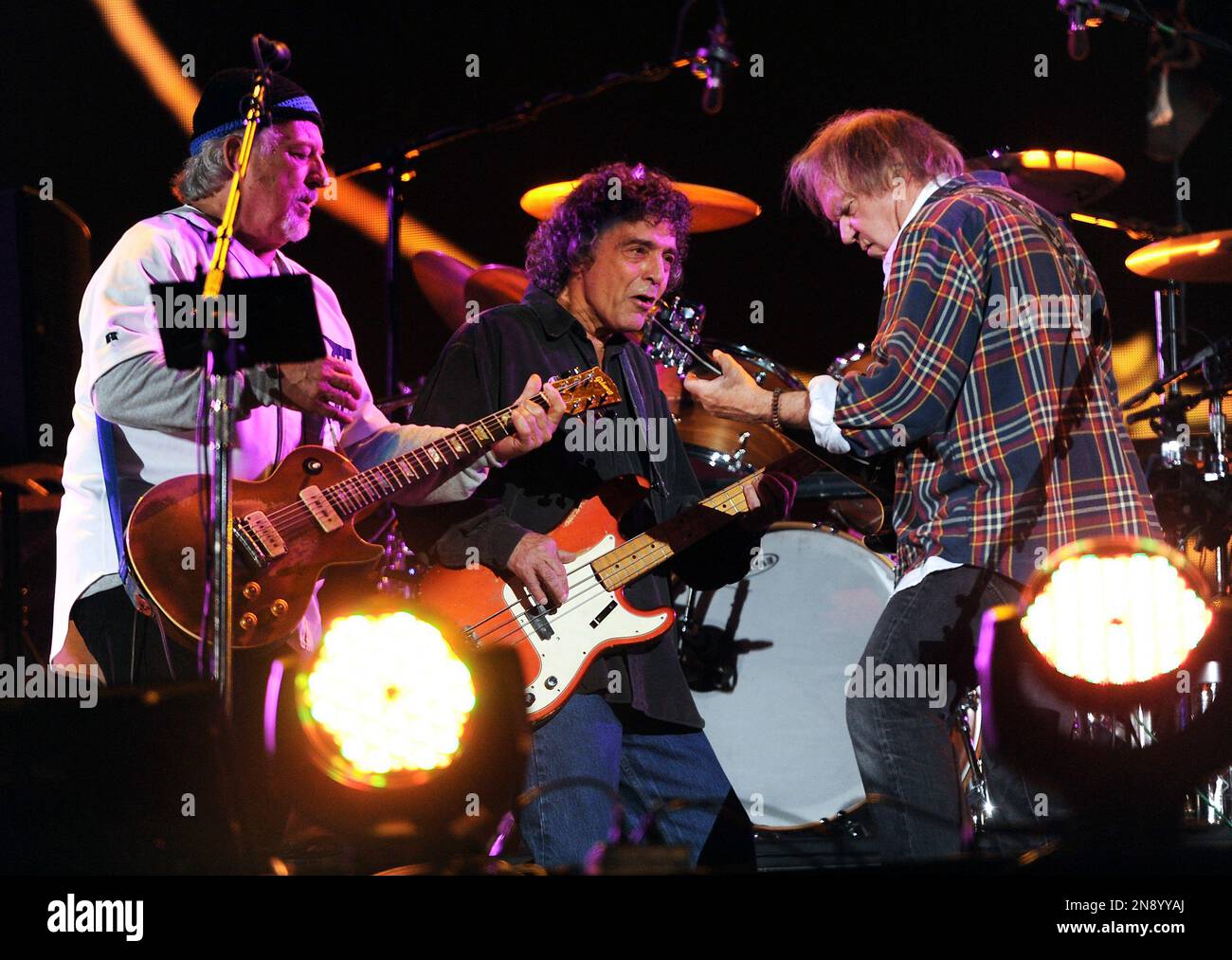 Musician Neil Young, right, performs with his band Crazy Horse ...