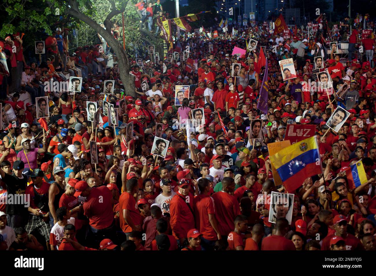 Supporters, some holding posters of Venezuela's independence hero Simon ...