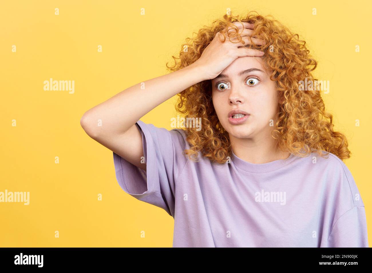 Woman with hand on head expressing desperation Stock Photo - Alamy