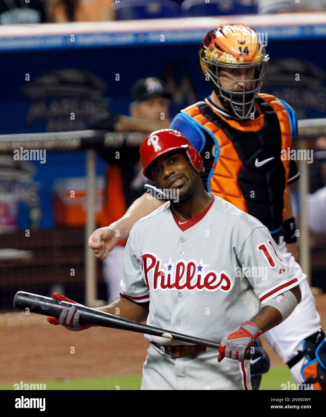 Philadelphia Phillies' Jimmy Rollins , foreground, reacts after ...