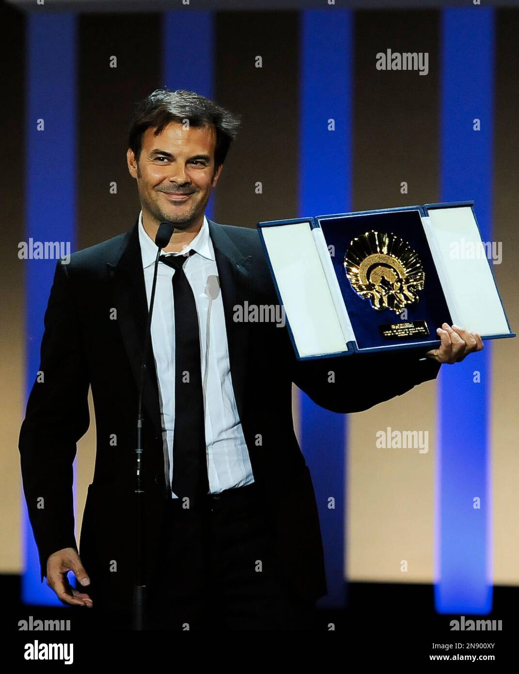 French film director Francois Ozon, celebrates after winning the Gold ...