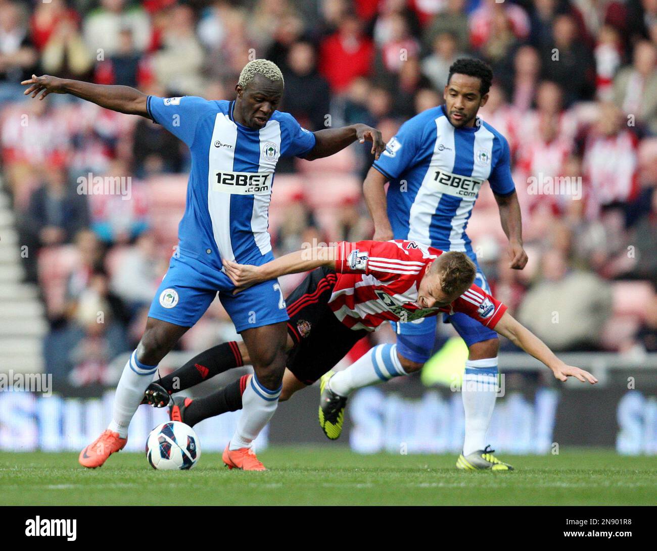 Wigan Athletic's Arouna Kone, left, vies for the ball with Sunderland's ...