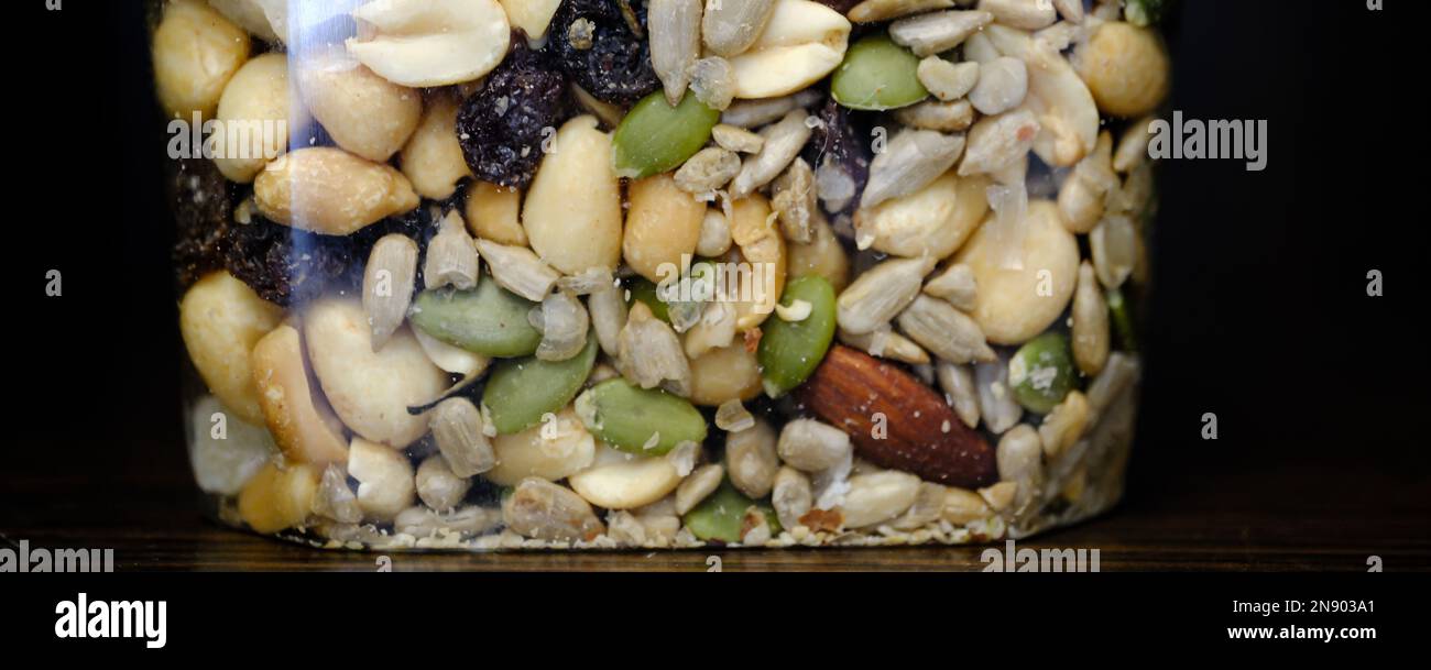 Trail mix in a container at home for hikes Stock Photo - Alamy