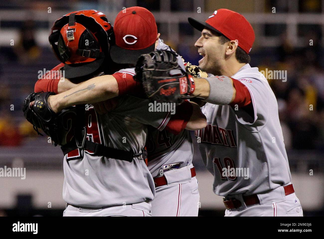 Cincinnati Reds starting pitcher Homer Bailey, center, hugs Cincinnati ...