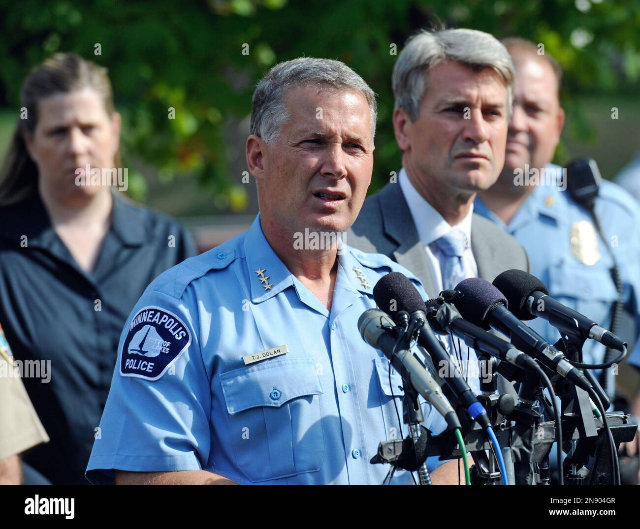 Minneapolis Police Chief Tim Dolan, center, speaks as Minneapolis Mayor ...