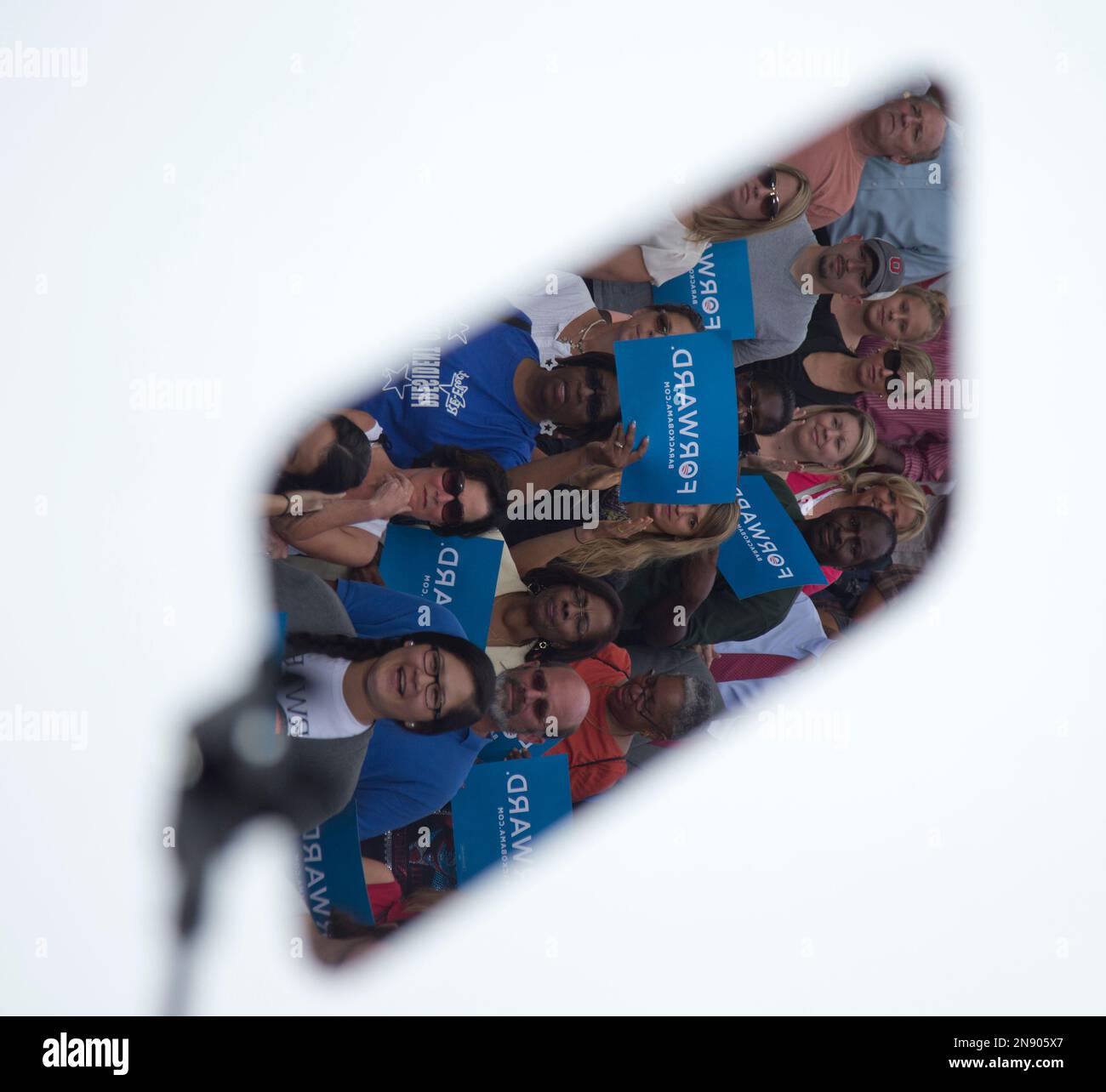 Supporters are seen reflected in a TelePrompTer as President Barack ...