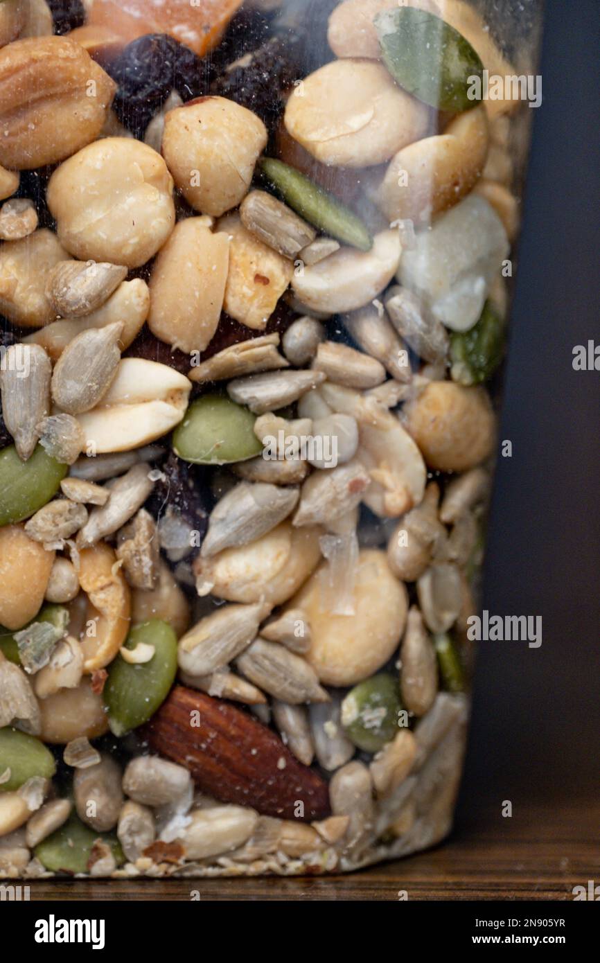 Trail mix in a container at home for hikes Stock Photo - Alamy