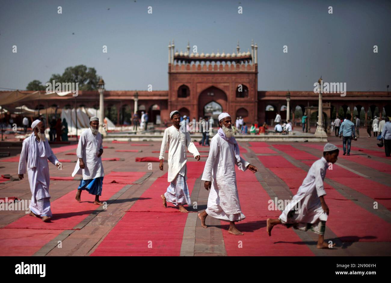 Muslims arrive to join Friday prayers at Jama Masjid, or Grand Mosque ...