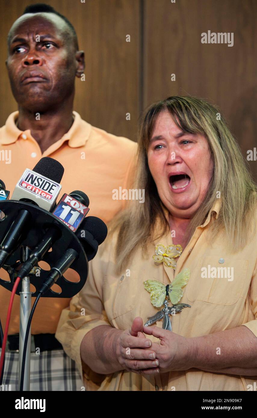 Michael Wade, left, and his wife, Karen Patterson react after a jury ...
