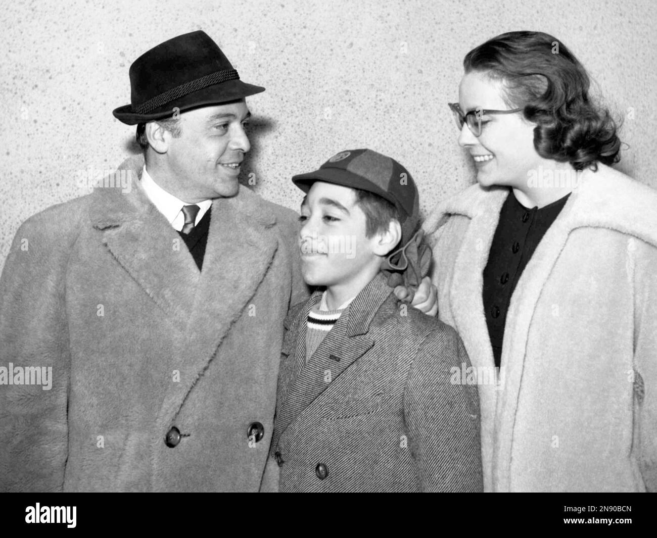British actor Herbert Lom is greeted by his wife, Dina, and their son ...