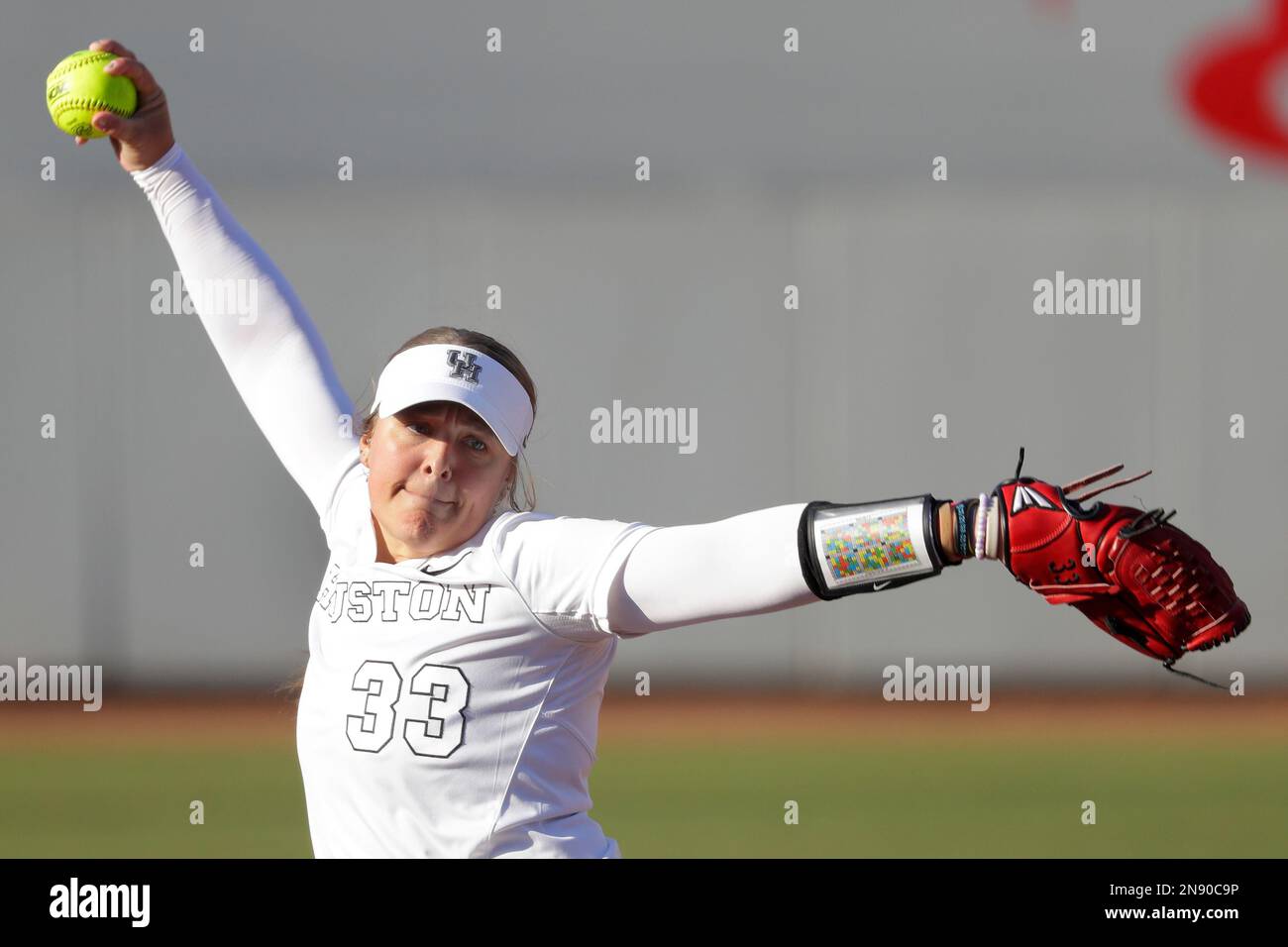 Houston starting pitcher Kenna Wilkey throws against Nebraska during an NCAA softball game on ...
