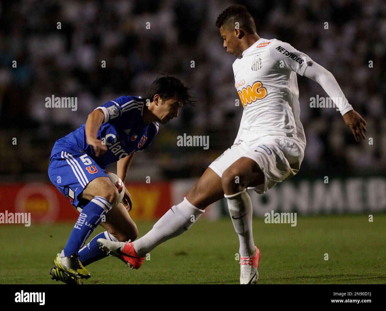 Chile's Universidad de Chile's Albert Acevedo, left, dribbles past ...