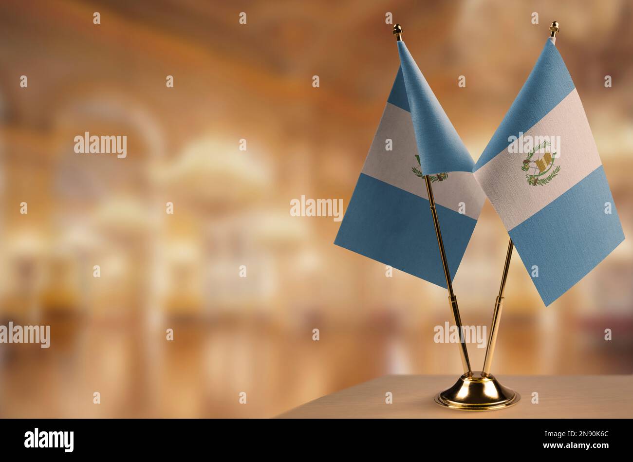 Small flags of the Guatemala on an abstract blurry background Stock ...