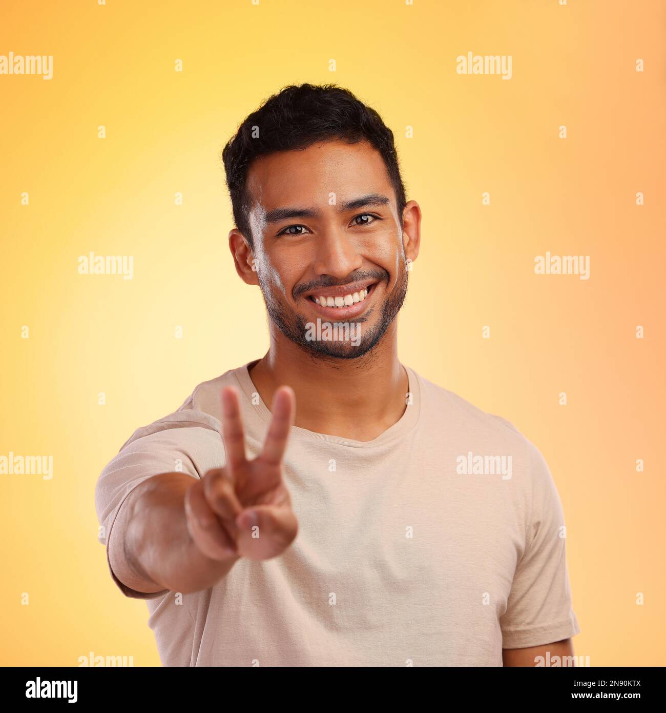 Portrait, hands and man with peace sign in studio isolated on a yellow ...