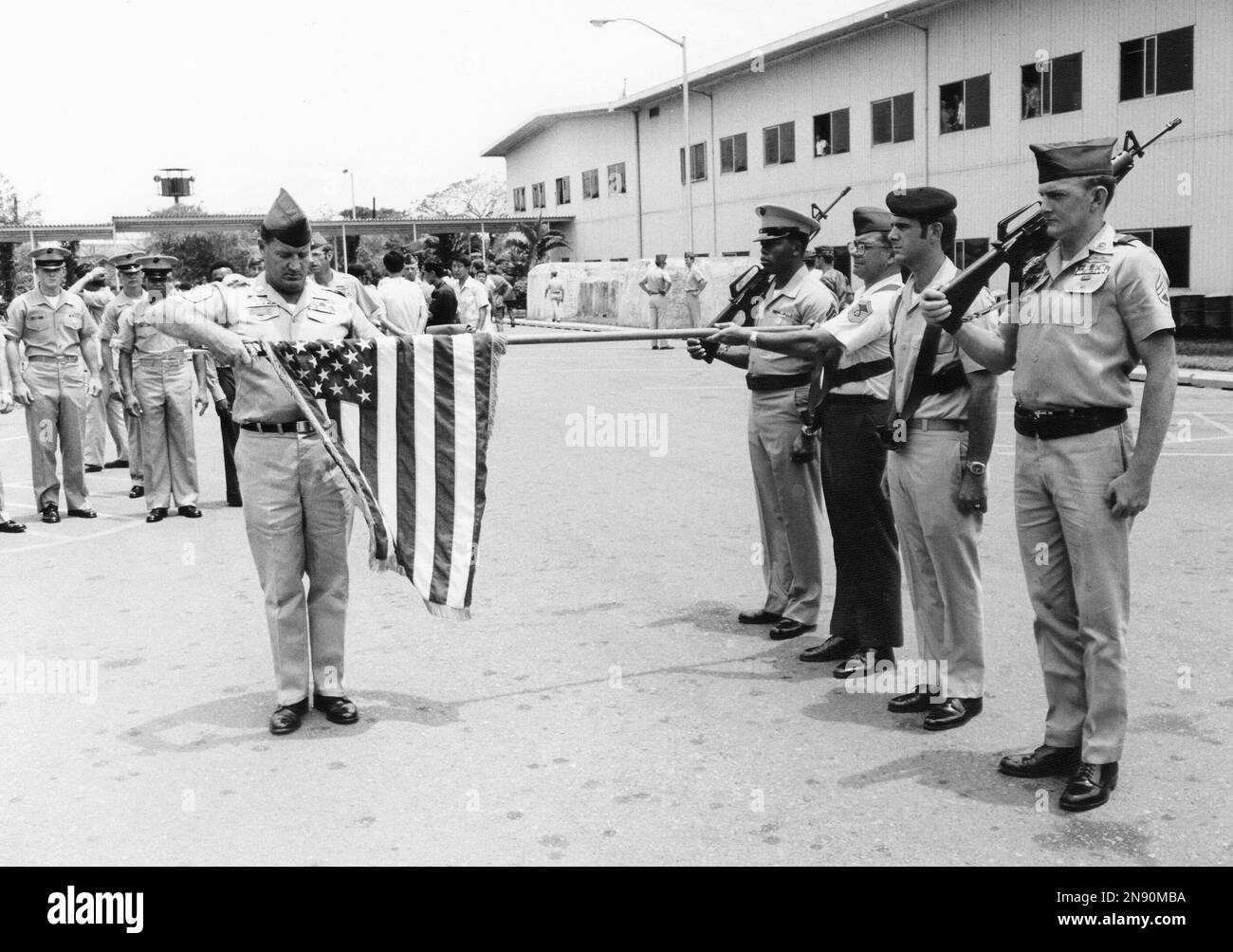 The American flag is furled at ceremonies marking official deactivation ...
