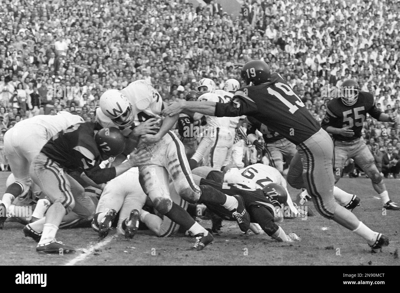 Wisconsin fullback Ralph Kurek (34), smashes off tackle into the end ...