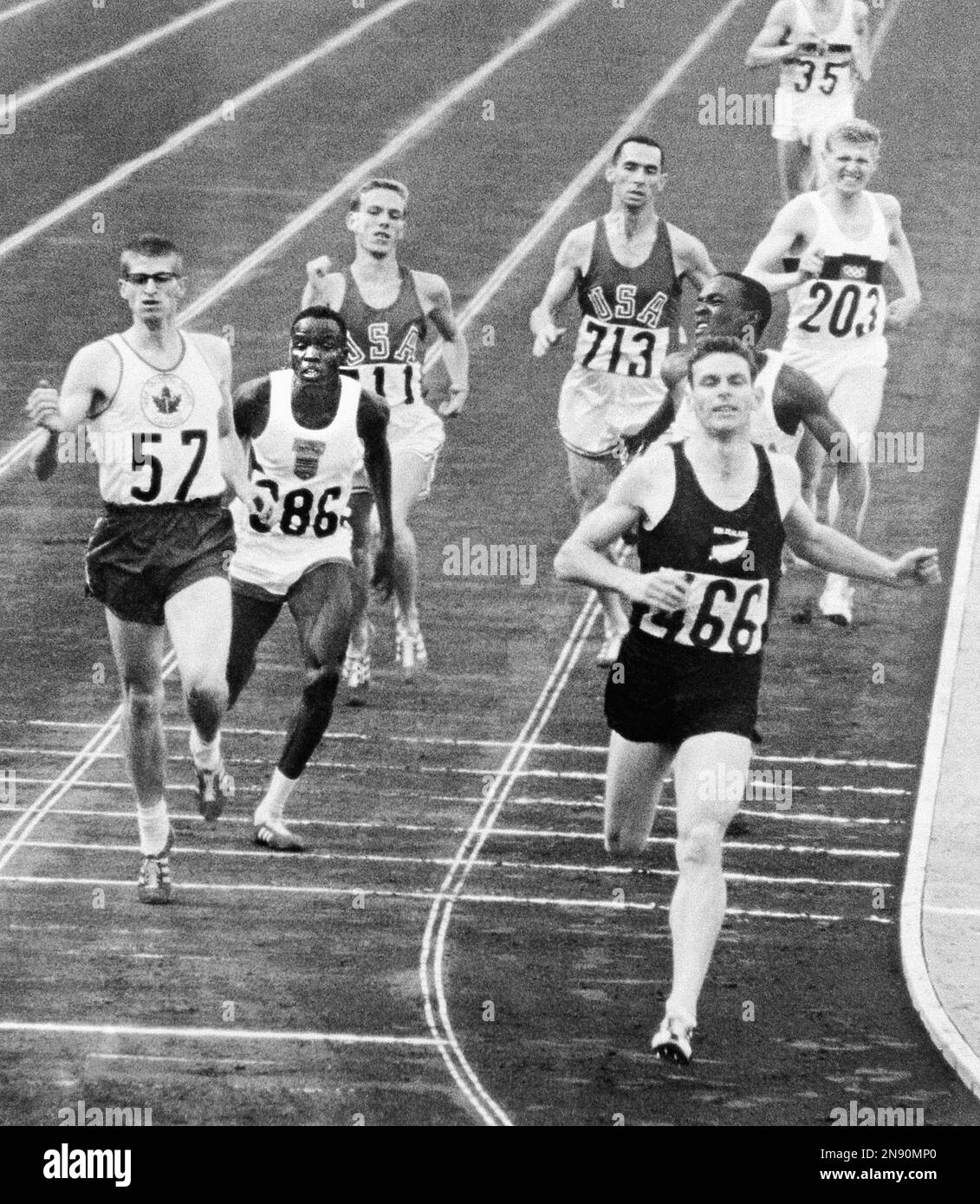New Zealand's Peter Snell, right, beats out Jim Beatty and Dyrol ...