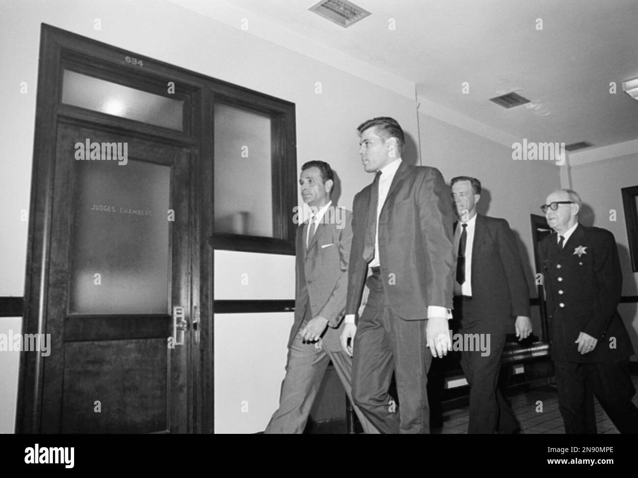 Melvin Powers, 23, walks into court August 5, 1965 with police where he ...