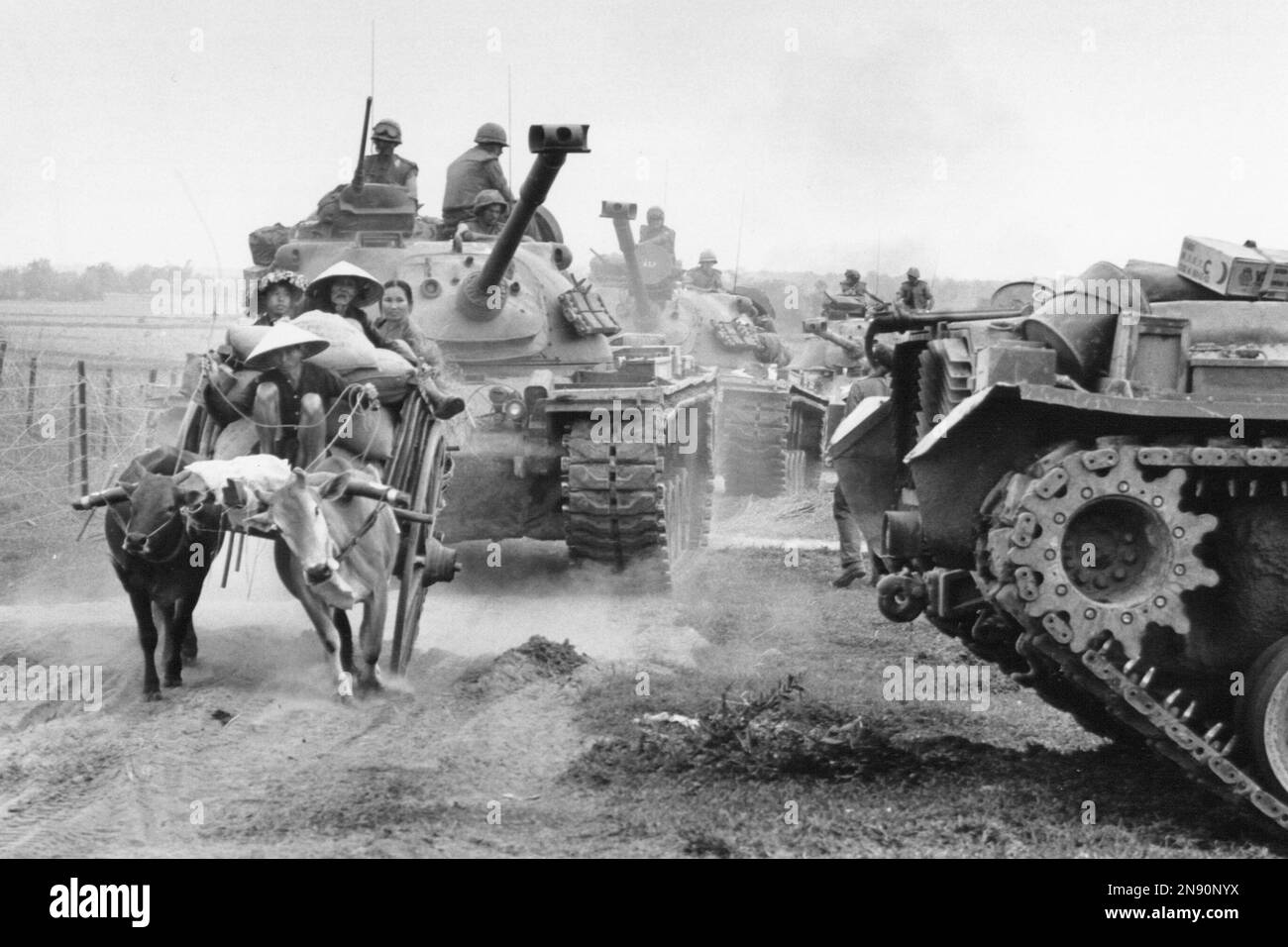 Followed by tanks of the U.S. 1st Infantry Division, oxen strain to ...