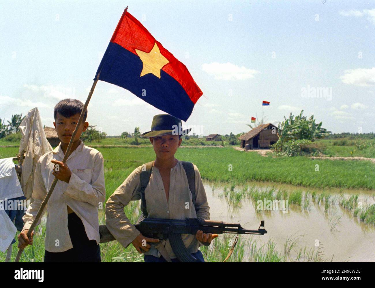 A teenage Viet Cong guerilla of a local guard unit proudly poses with ...