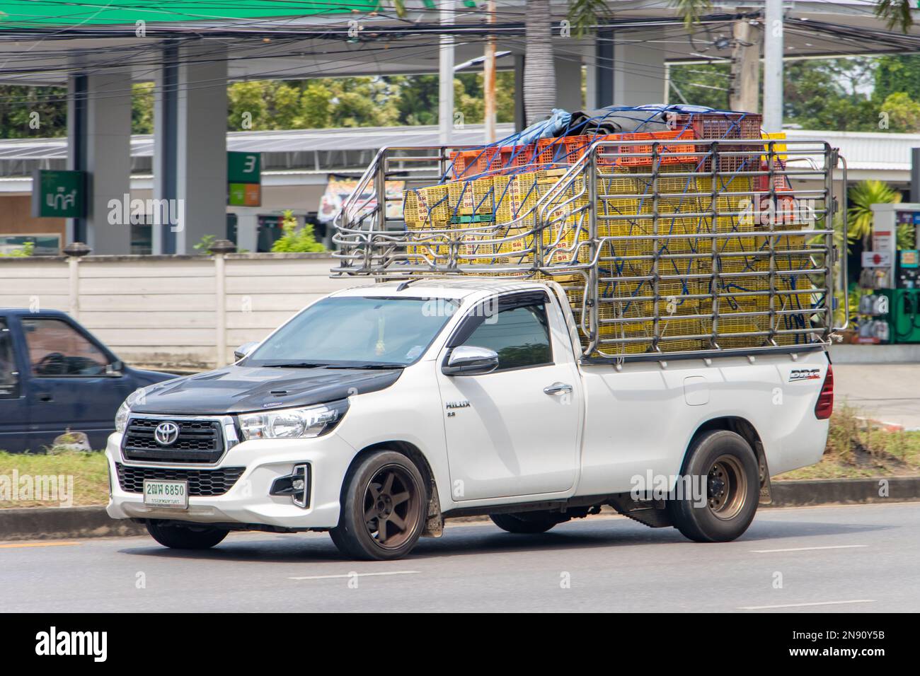 RATCHABURI, THAILAND, NOV 16 2022, A fully loaded pick up is driving ...