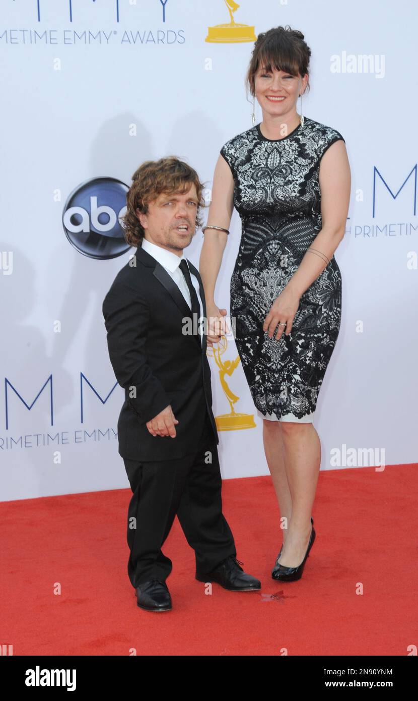 Peter Dinklage, right, and Erica Schmidt arrive at the 64th Primetime ...
