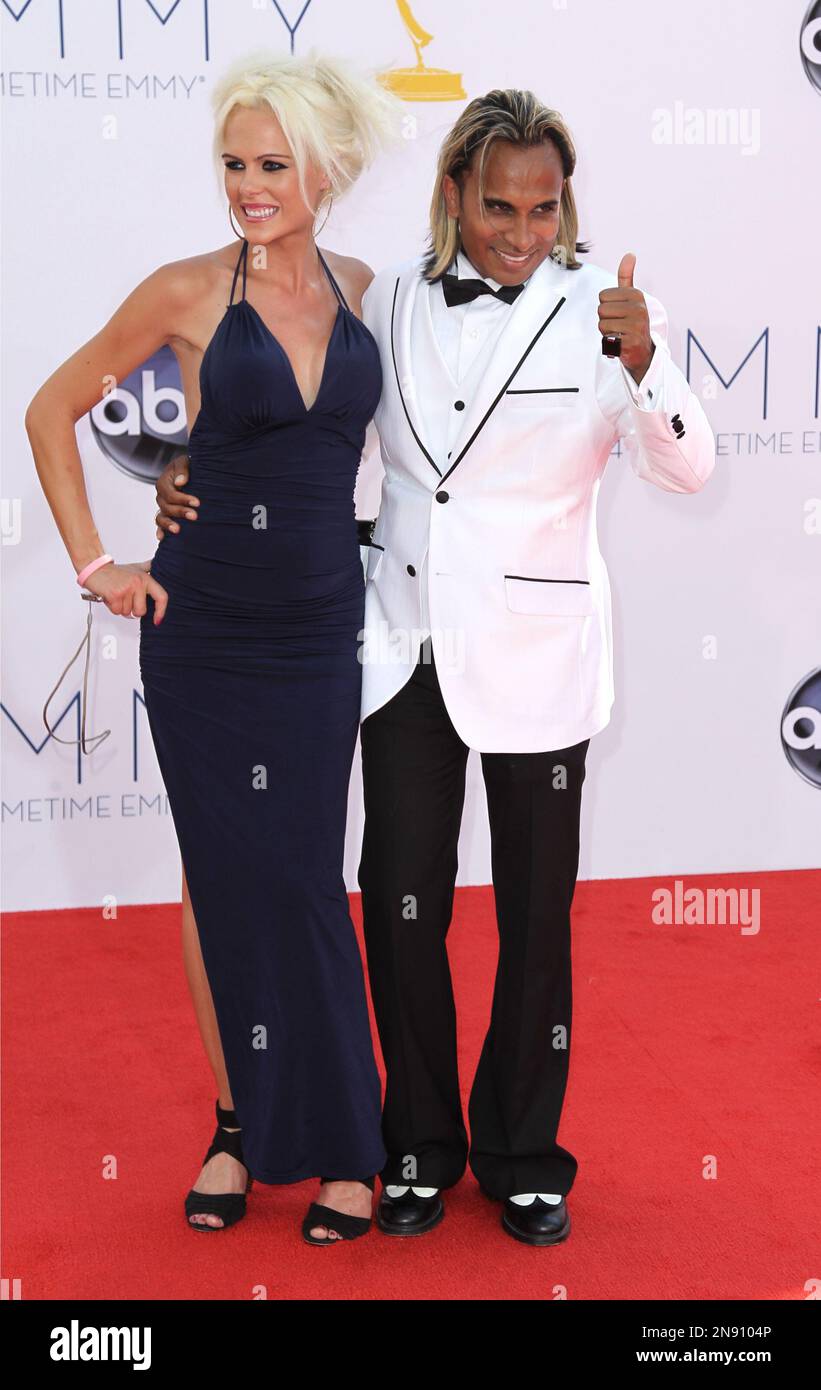 Singer Reggie Benjamin, right, and guest arrive at the 64th Primetime ...